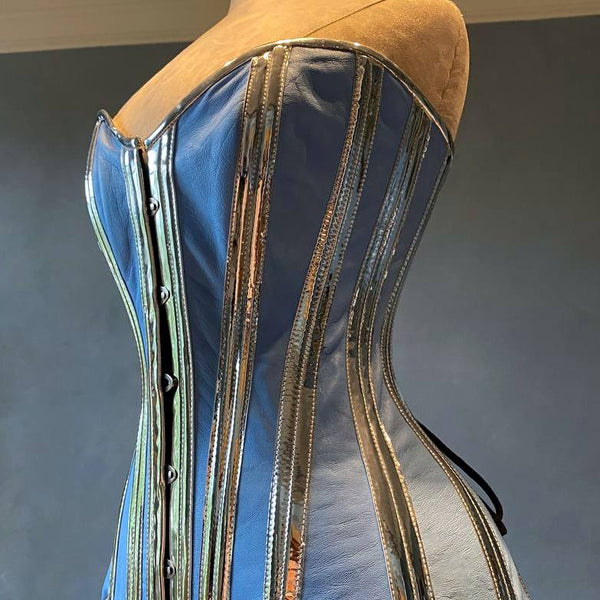 Long steel-boned leather and PVC corset with long hips, double steel b ...