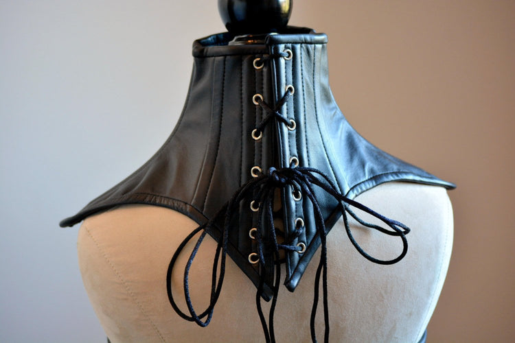 A real leather corsetted collar laced at the back, different colors av ...